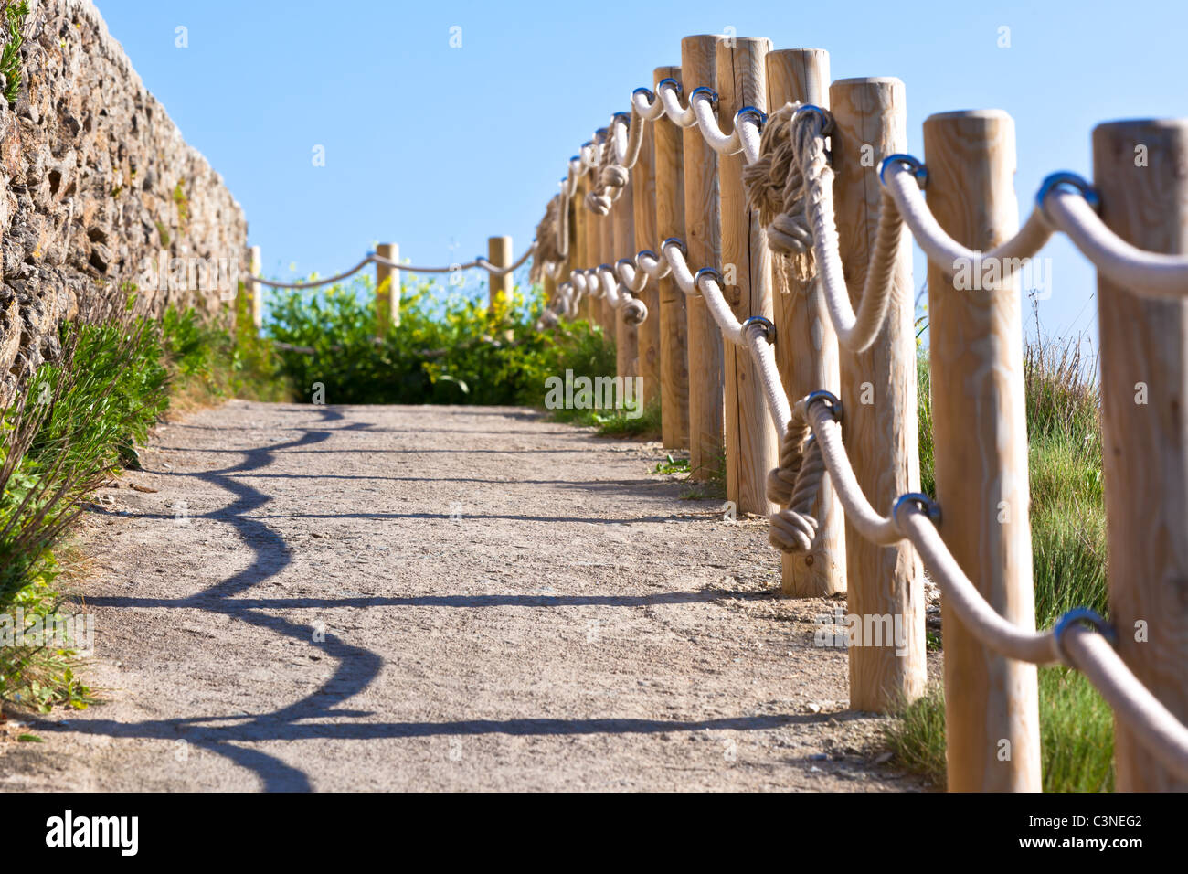 Pathway with wood post and thick rope fence. Taken at Saint-Mathieu ...