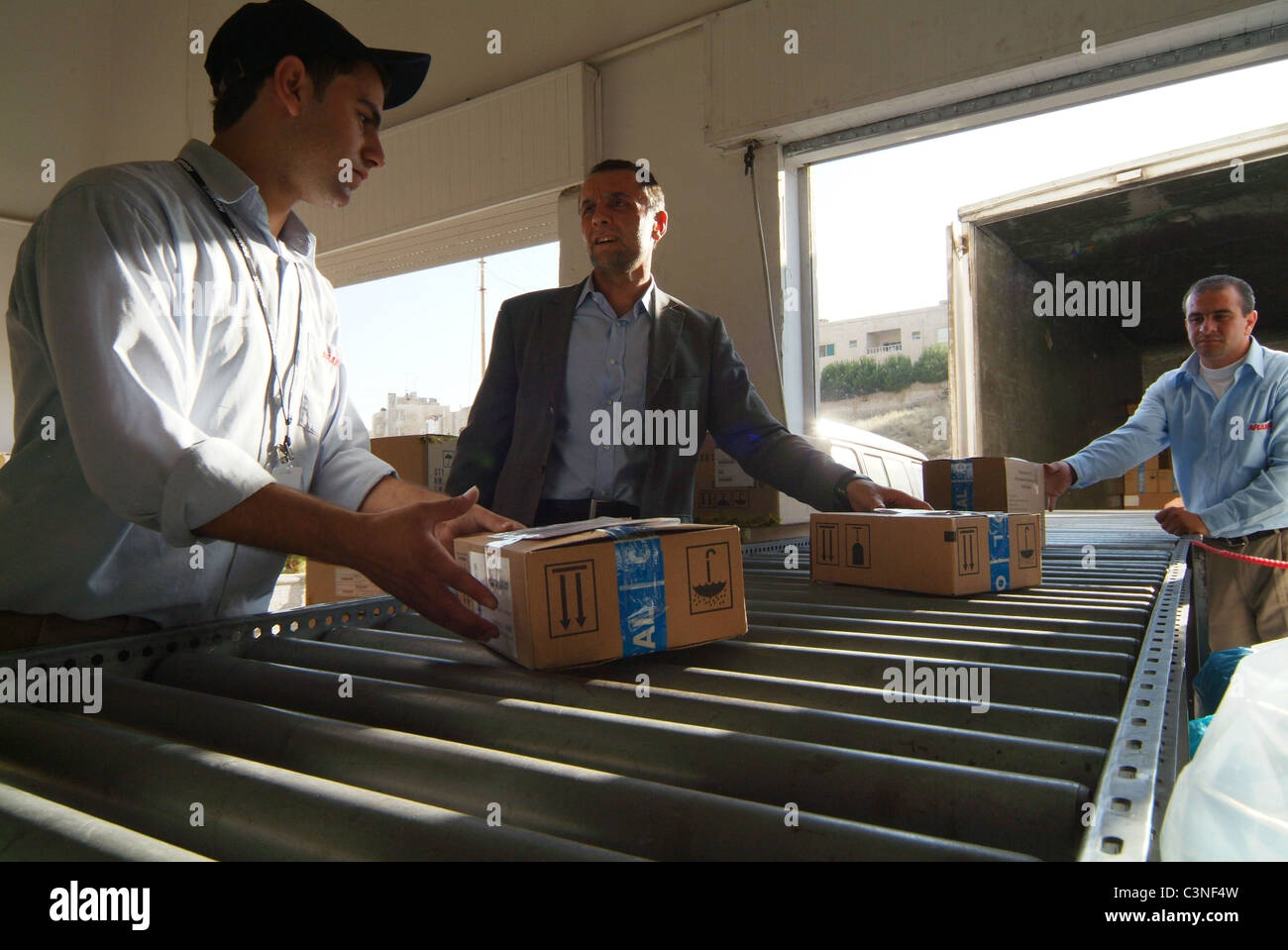 Fadi Ghandour, founder and CEO of ARAMEX, checking up on activity at ...