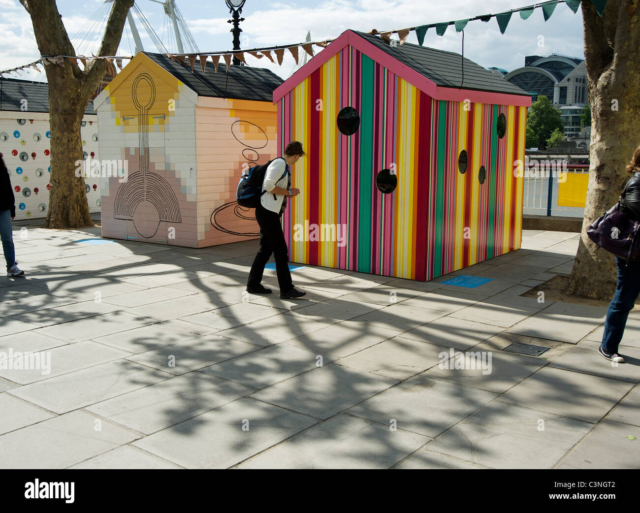 looking at colourful beach huts on London's Southbank Stock Photo - Alamy