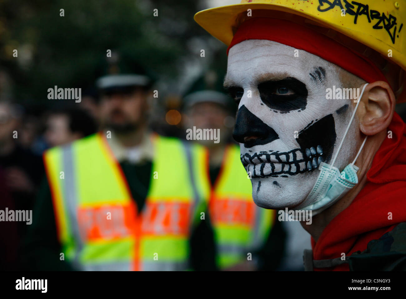 A demonstrator with scary skeleton makeup paint on his face takes part ...