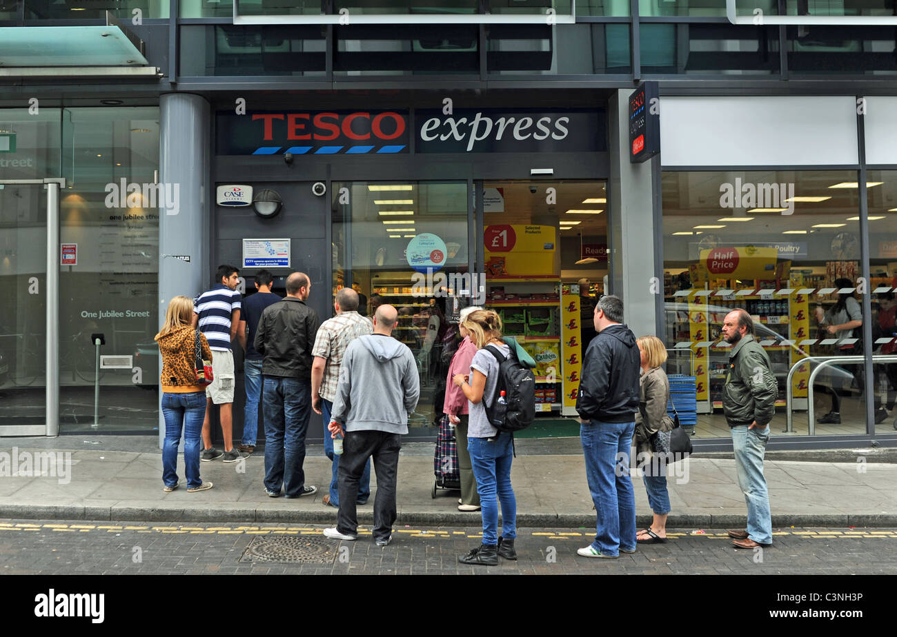 Queue For Cash Machine At Tesco Express Shop In Brighton City Centre UK Stock Photo Alamy queue-for-cash-machine-at-tesco-express-shop-in-brighton-city-centre-uk-stock-photo-alamy