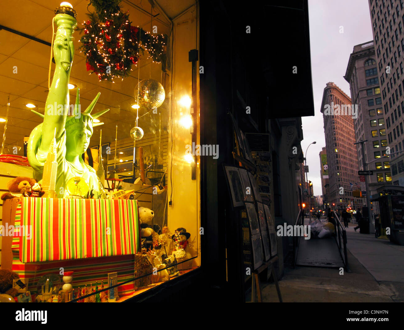 A Statue of Liberty model in an illuminated shop window near the ...