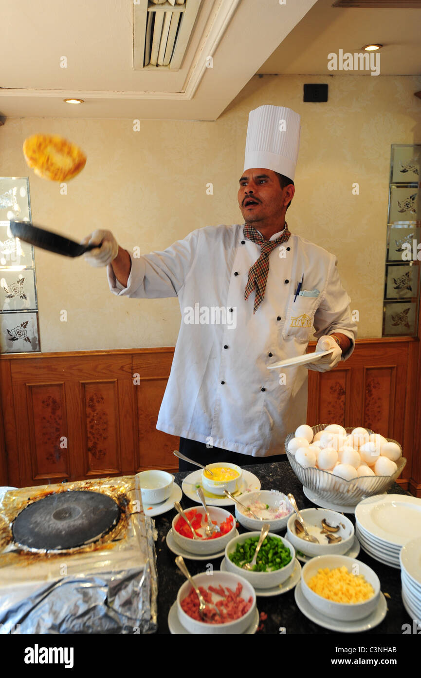 Africa Middle East Egypt Egyptian a chef is flipping an omelet on a ...