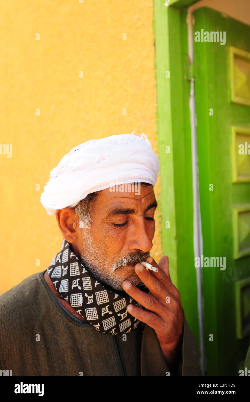 Africa Middle East Egypt Egyptian man in white turban smoking a ...