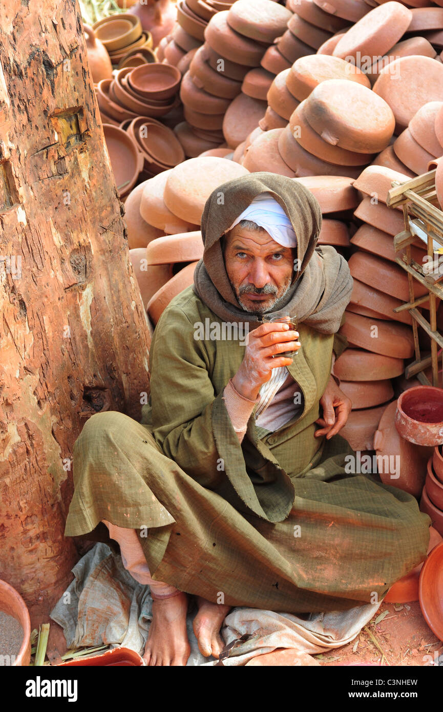 Africa Middle East Egypt Egyptian a man takes a break from making clay ...
