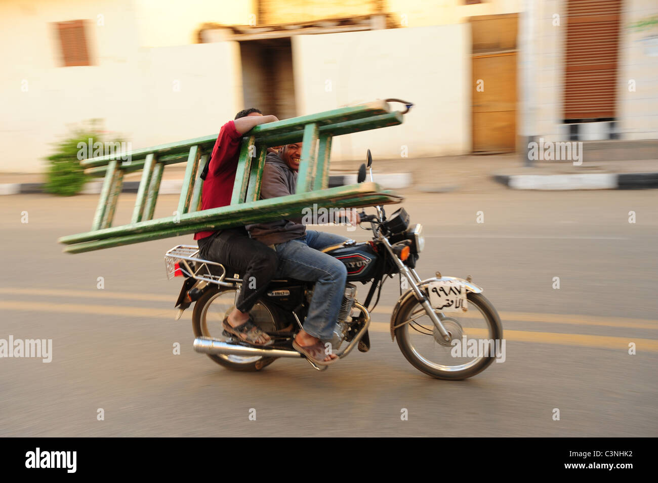 Africa Middle East Egypt Egyptian Luxor Men riding on a motorcycle with ...