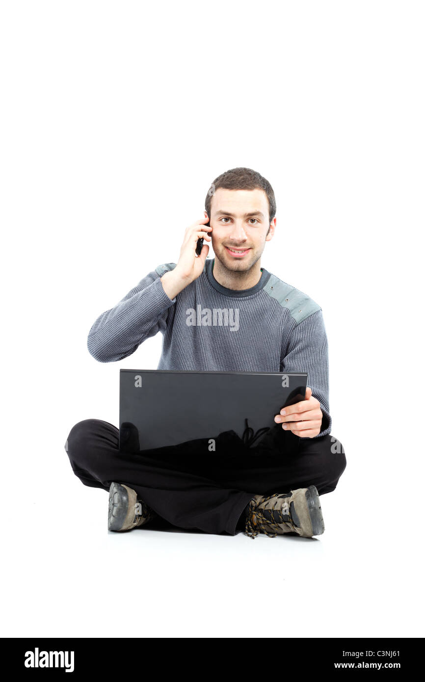 Happy young man with laptop isolated on white background Stock Photo ...