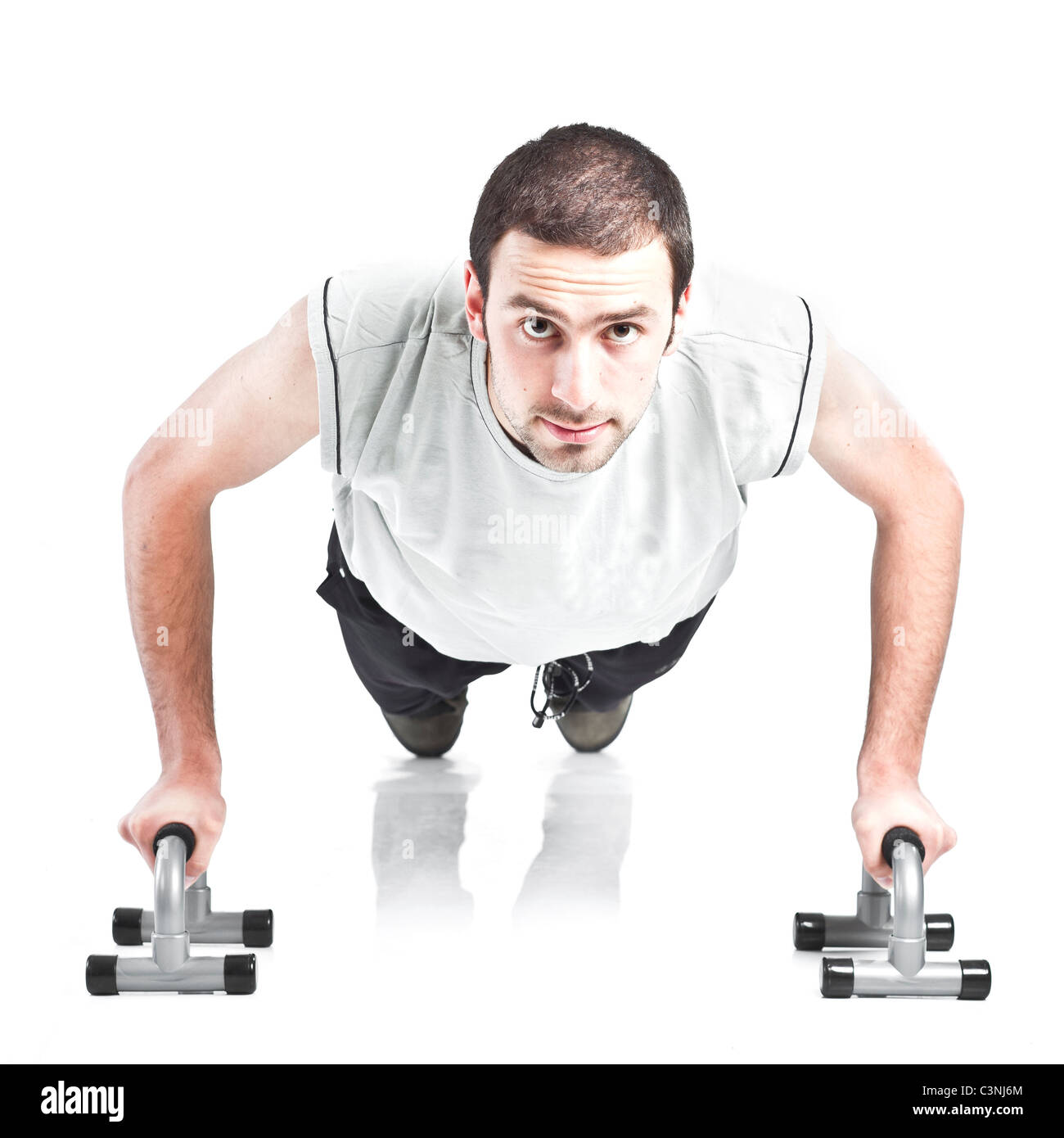 Young guy doing push ups isolated on white background Stock Photo - Alamy