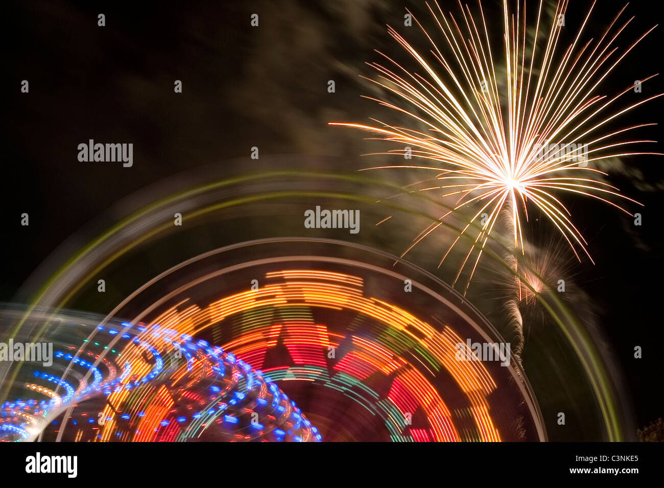 Evergreen State Fair ferris wheel at night with rides and motion with ...