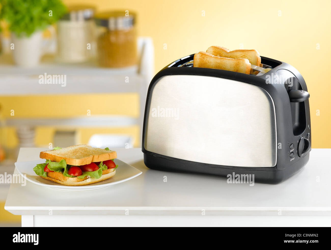 Bread toaster in the kitchen Stock Photo - Alamy