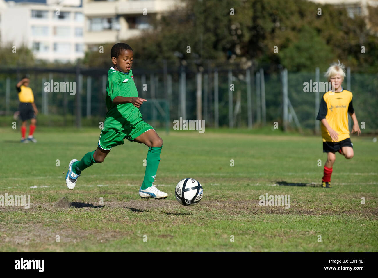 Young football player of an U11 team attacking Cape Town South Africa ...