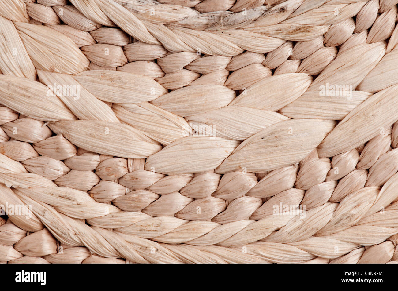 Detail of a decorative traditional place mat woven from natural plant ...