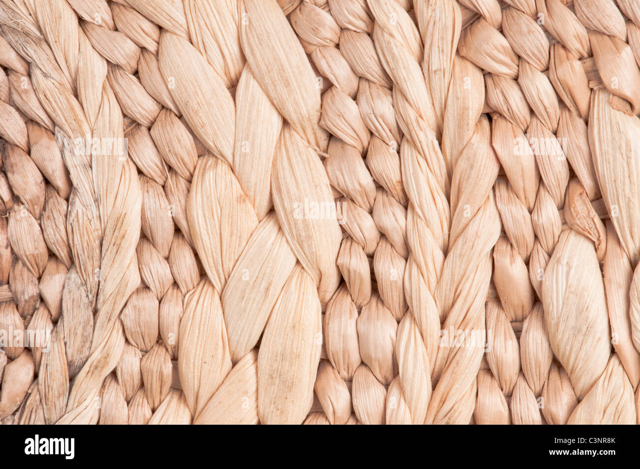 Detail of a decorative traditional place mat woven from natural plant ...