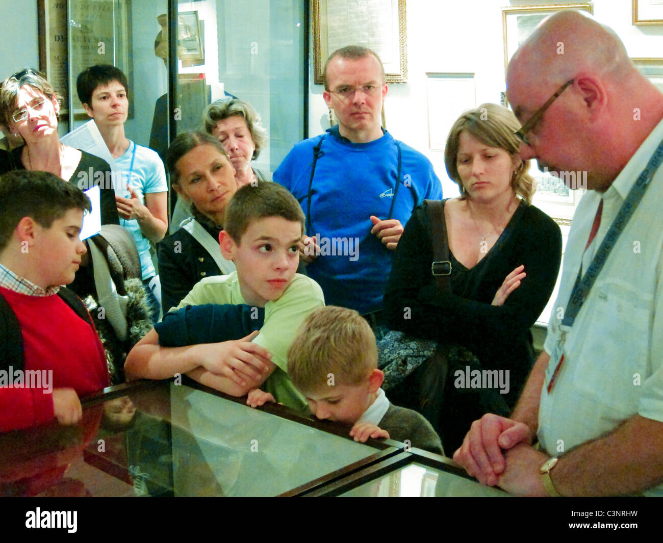 Paris, France, Tour Guide leading groups Lecturing People at Exhibit in ...