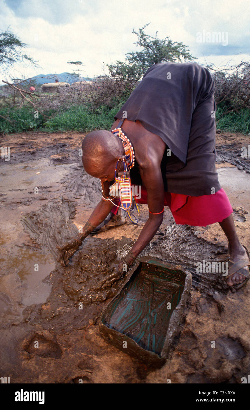 Women cow dung africa hi-res stock photography and images - Alamy
