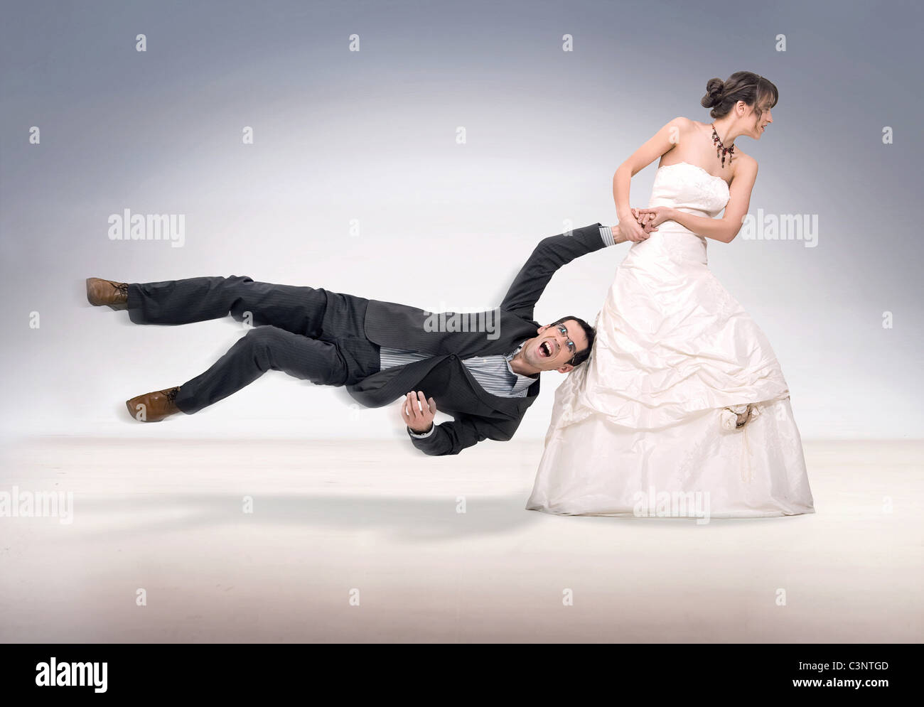 Bride abusing groom, isolated on white Stock Photo - Alamy