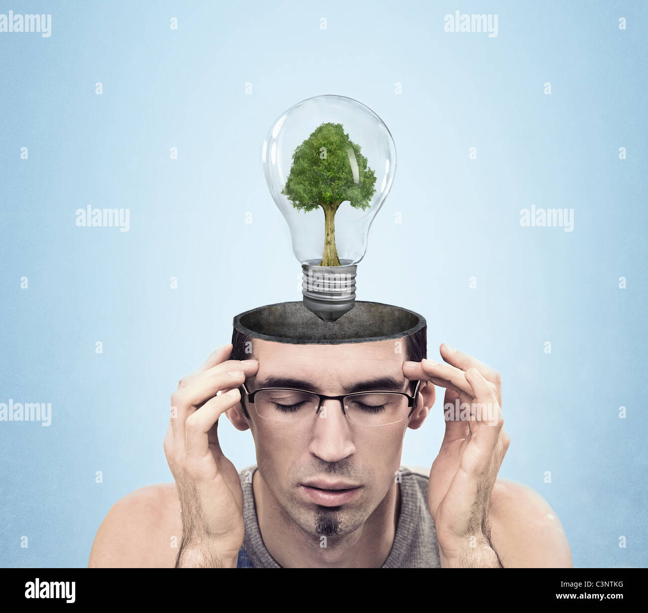 Open minded man with green energy symbol Stock Photo - Alamy