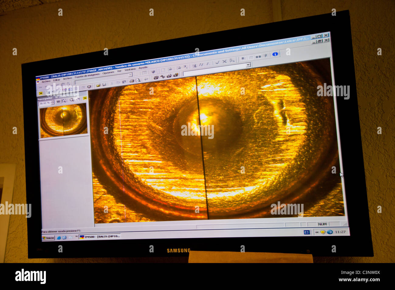 A microscopic view of bullet casing marks projected on the screen at ...