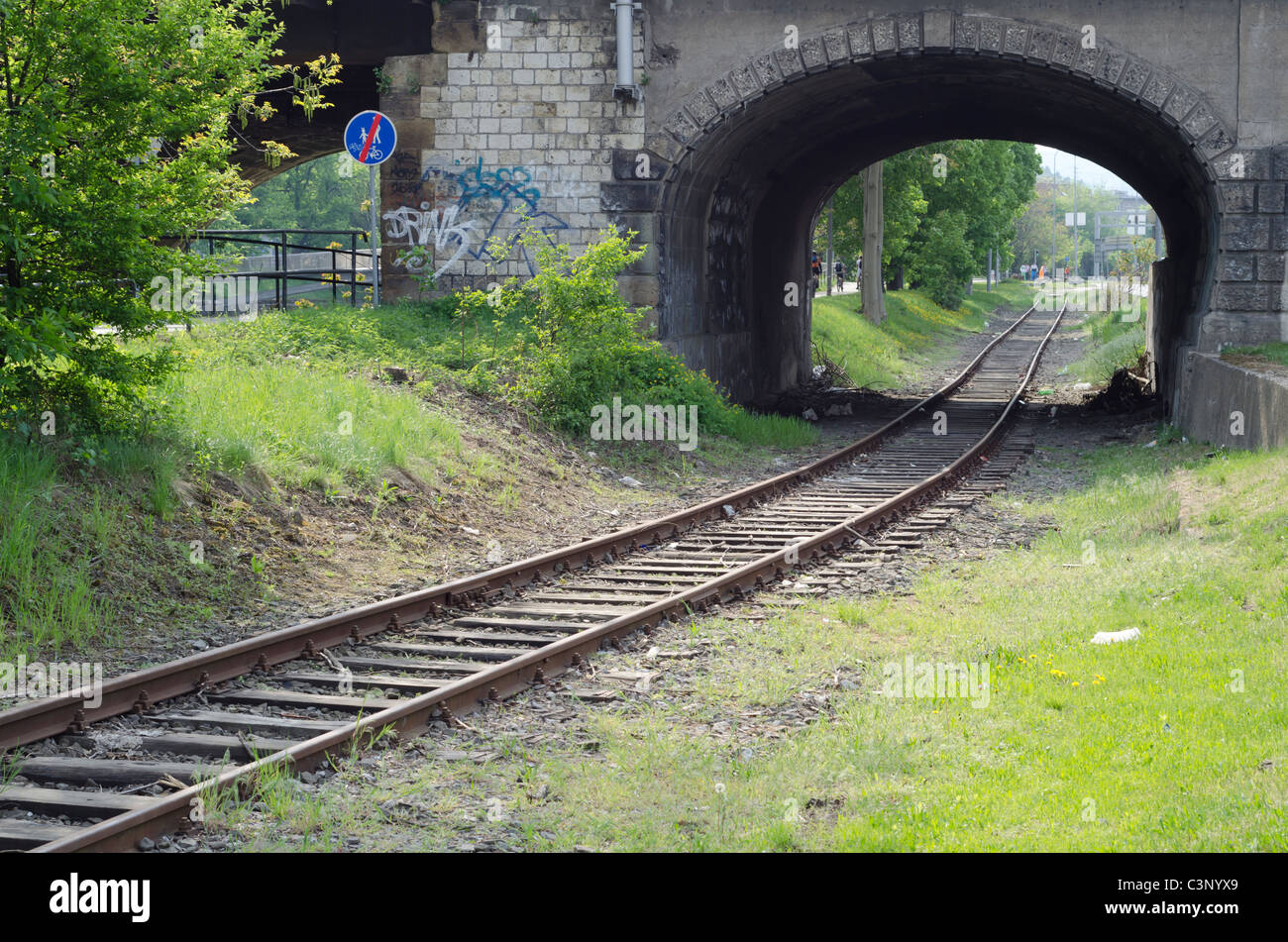 Disused railway line under bridge Stock Photo - Alamy