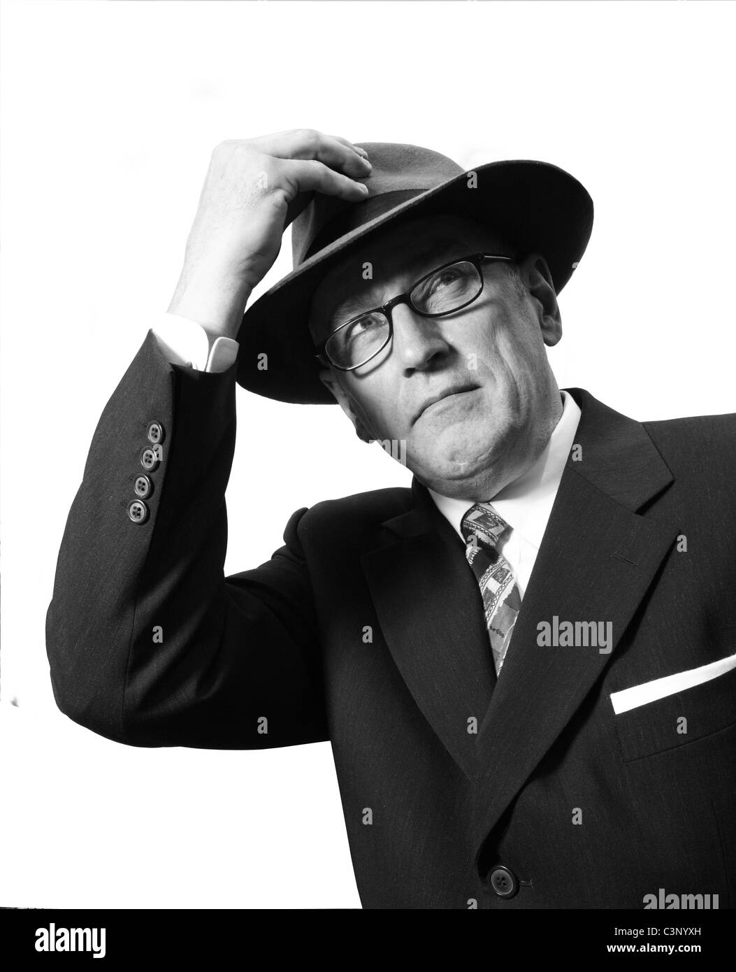 Retro shot of 1950s man wearing an old fashioned hat, black and white ...