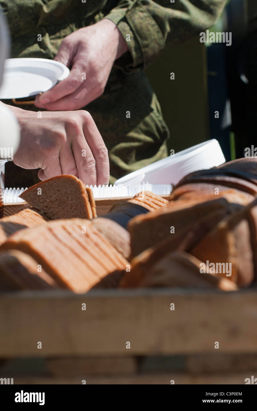Russian soldiers cook the food for the people during a Victory Day ...