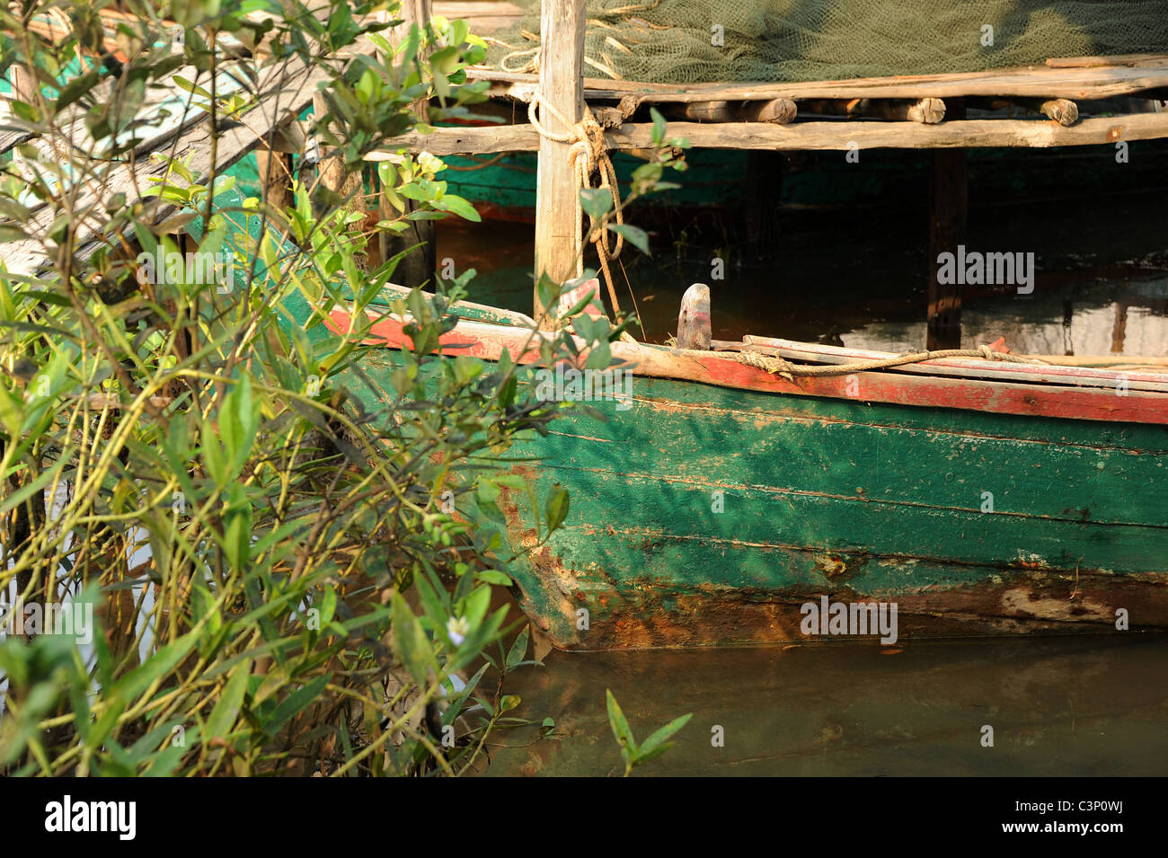 Simple wooden fishing boat in Kampot village, Southern Cambodia Stock ...