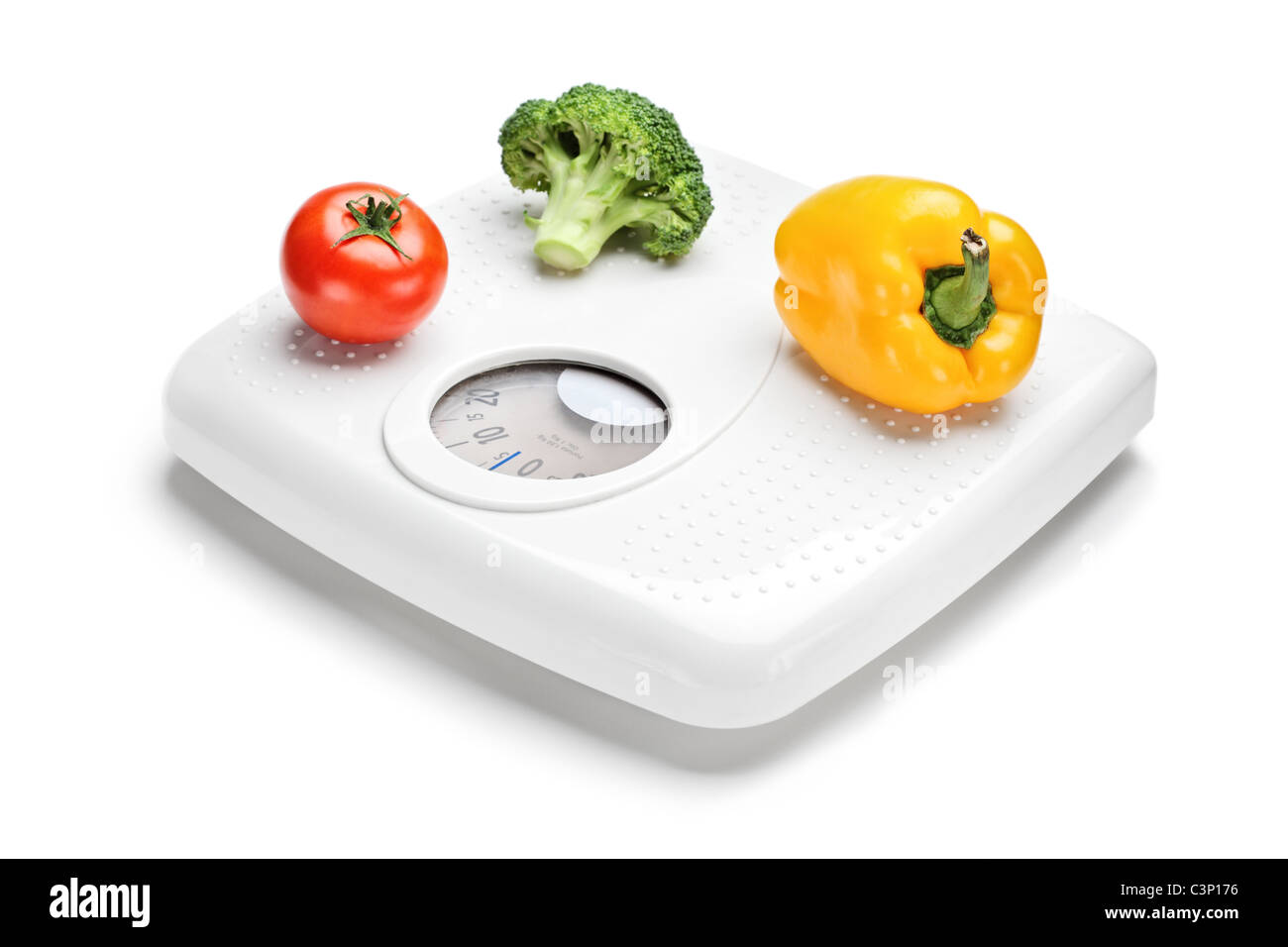 Vegetables on a weight scale Stock Photo - Alamy