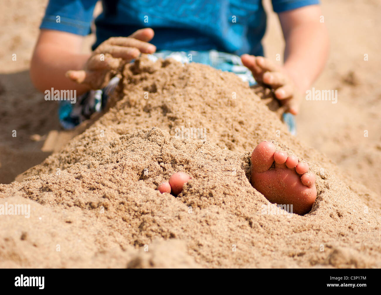 Buried in the sand Stock Photo - Alamy