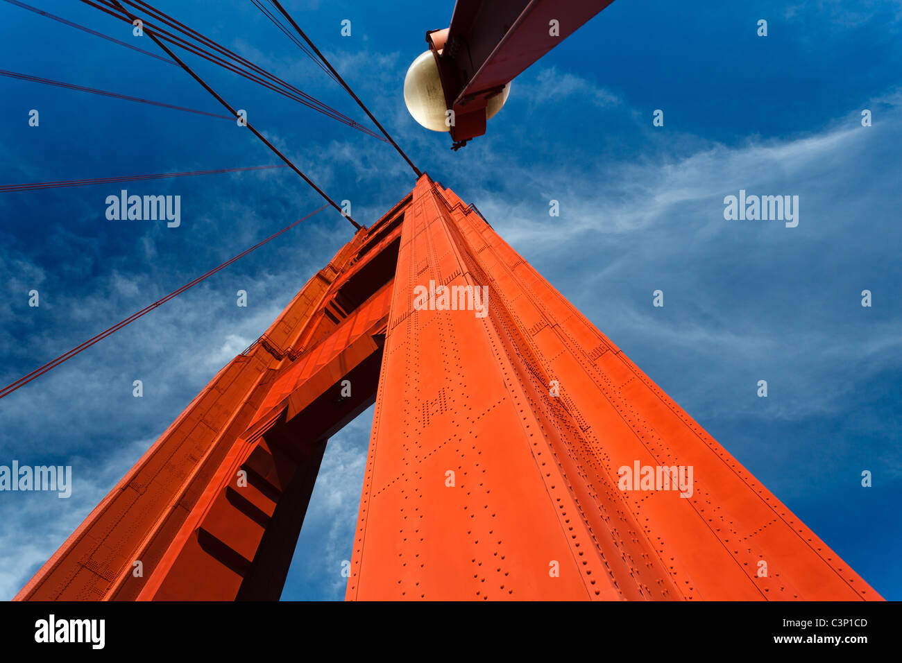 Bright Orange Golden Gate Bridge Tower and Lamp Post Rise into Bright ...