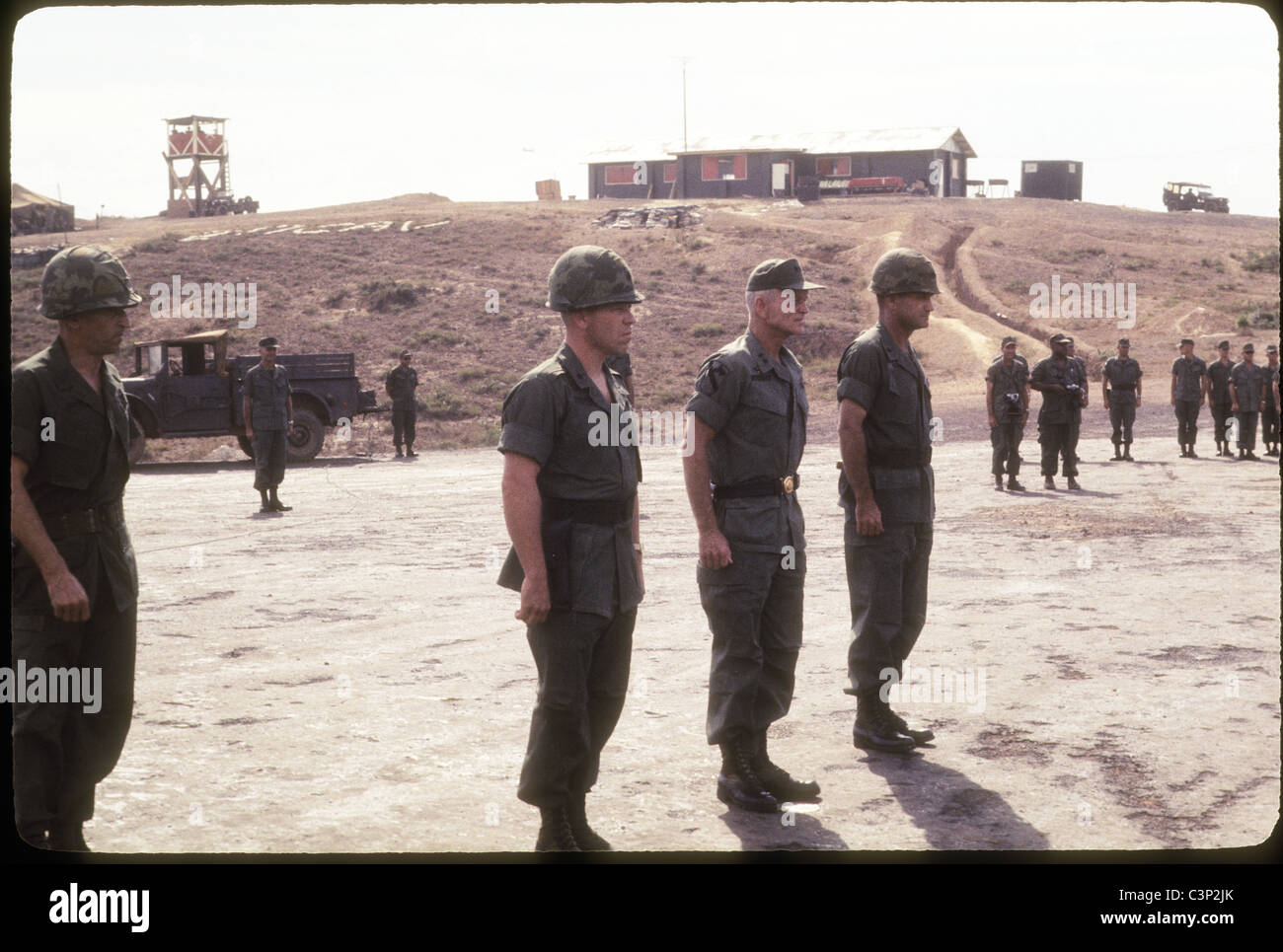 Officers and enlisted men of 2/17th Cavalry standing at attention at ...