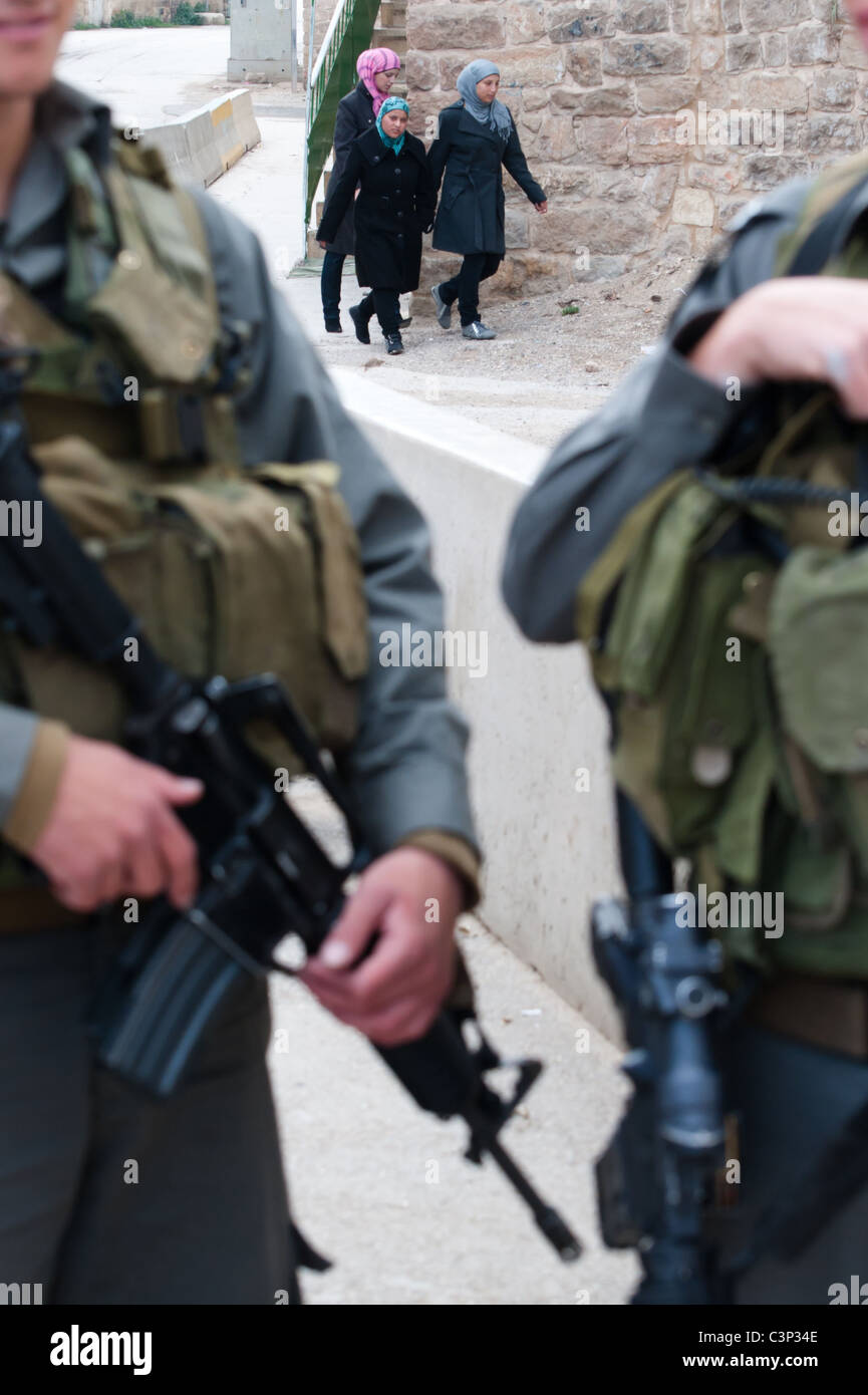 An Israeli military checkpoint controls movement along Shuhada Street ...