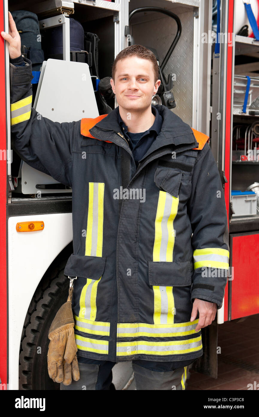 Picture from a young and successful firefighter at work Stock Photo - Alamy