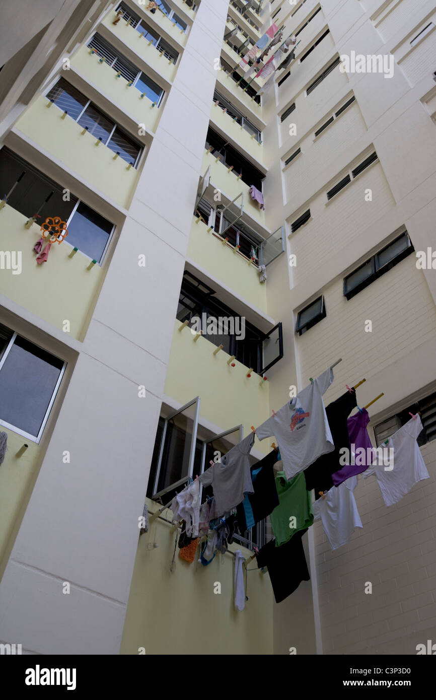 LAUNDRY WASHING HANGING FROM SINGAPORE APARTMENT BLOCK Stock Photo - Alamy