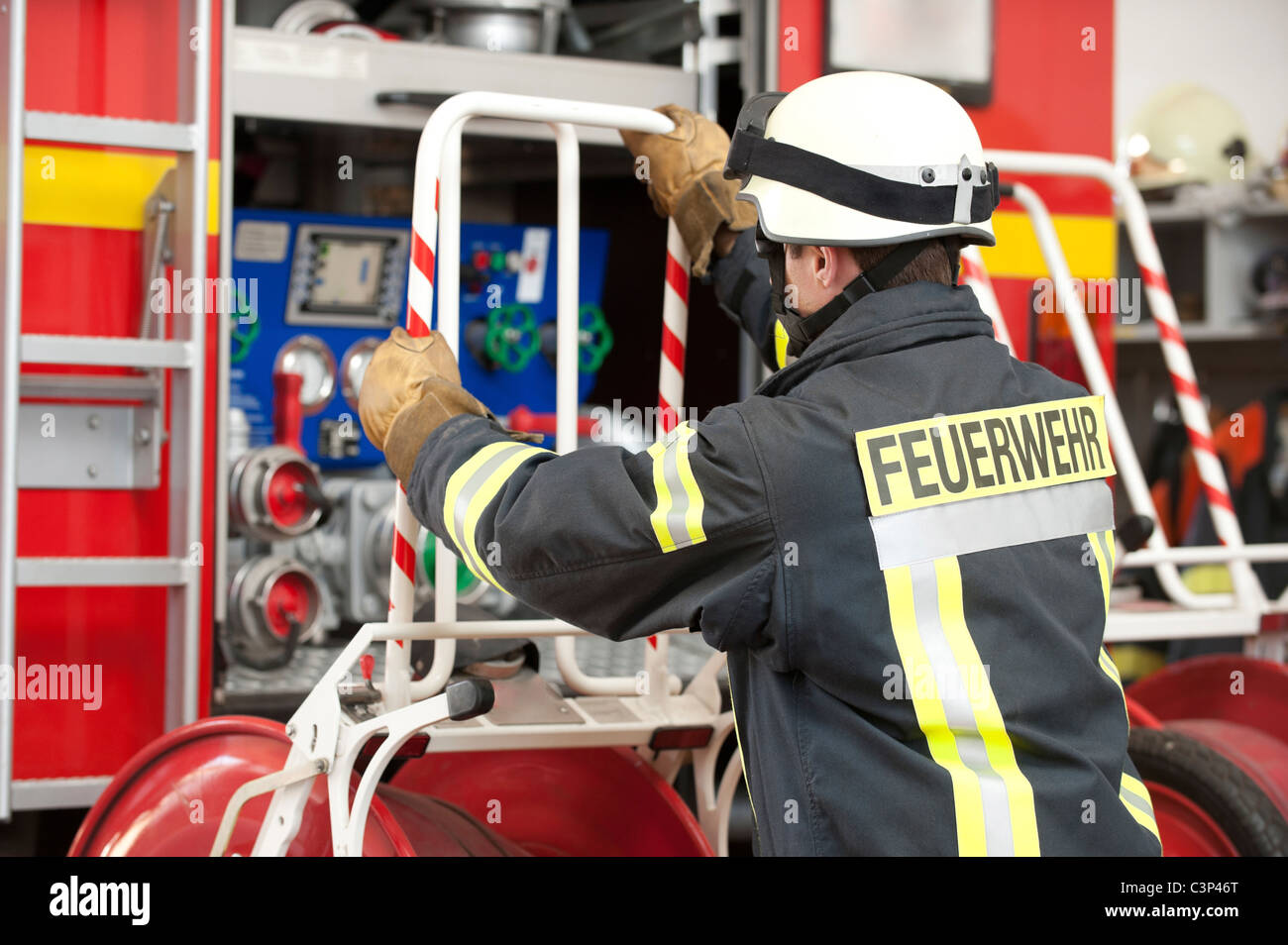 Picture from a young and successful firefighter at work Stock Photo - Alamy