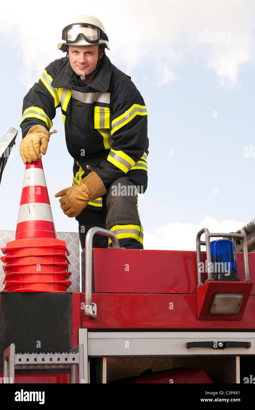 Picture from a young and successful firefighter at work Stock Photo - Alamy