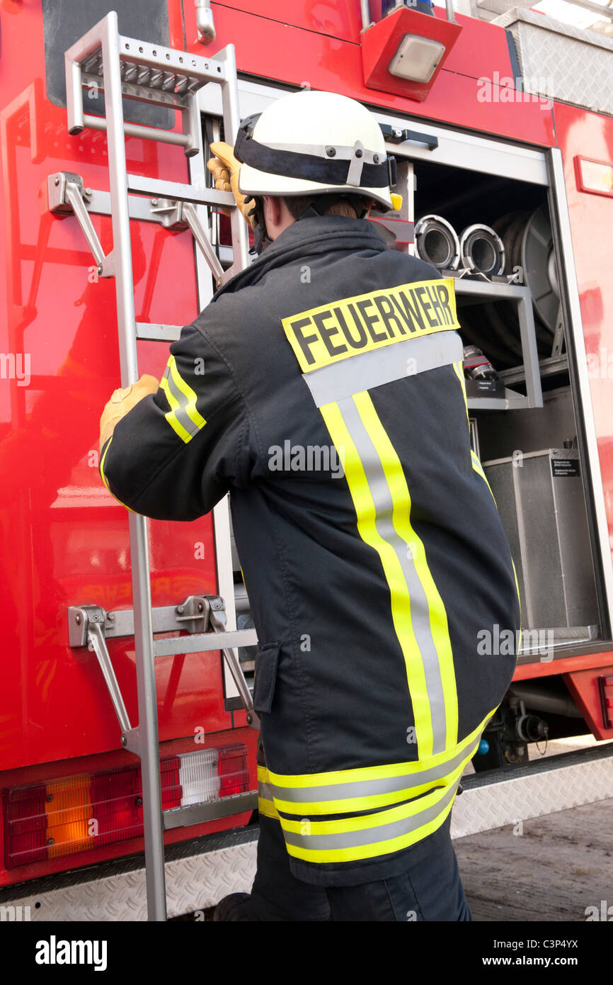 Picture from a young and successful firefighter at work Stock Photo - Alamy