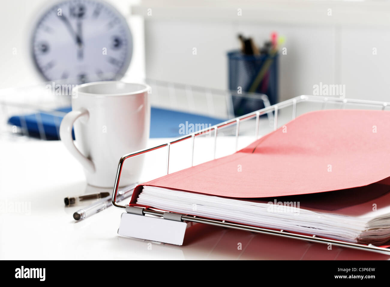 Wire basket with loose-leaf binder Stock Photo - Alamy