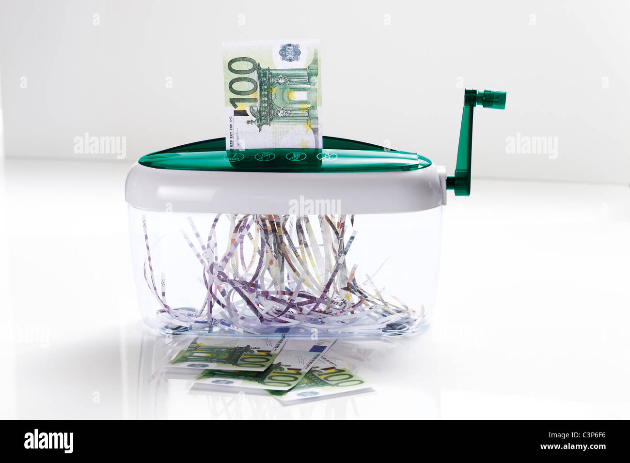 100 Euro notes in shredder Stock Photo - Alamy