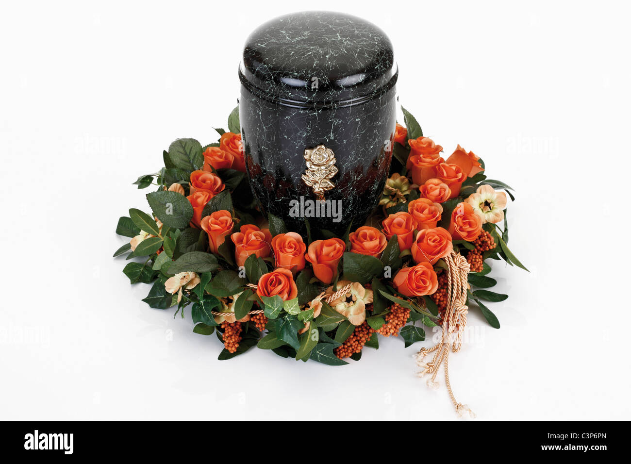 Cremation urn and floral wreath, elevated view Stock Photo - Alamy