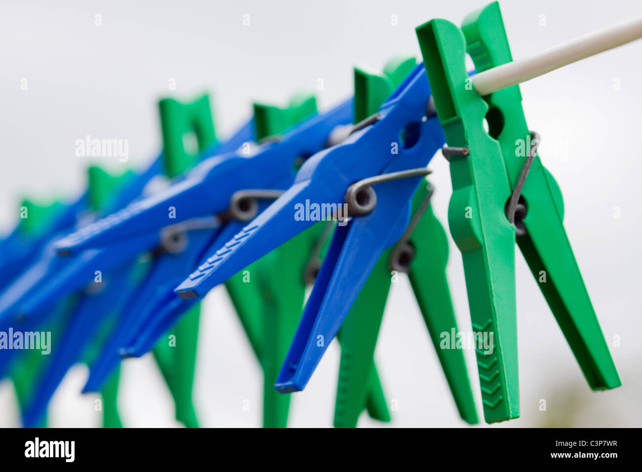Plastic Clothes Pegs Hanging on a clothes Line Stock Photo - Alamy