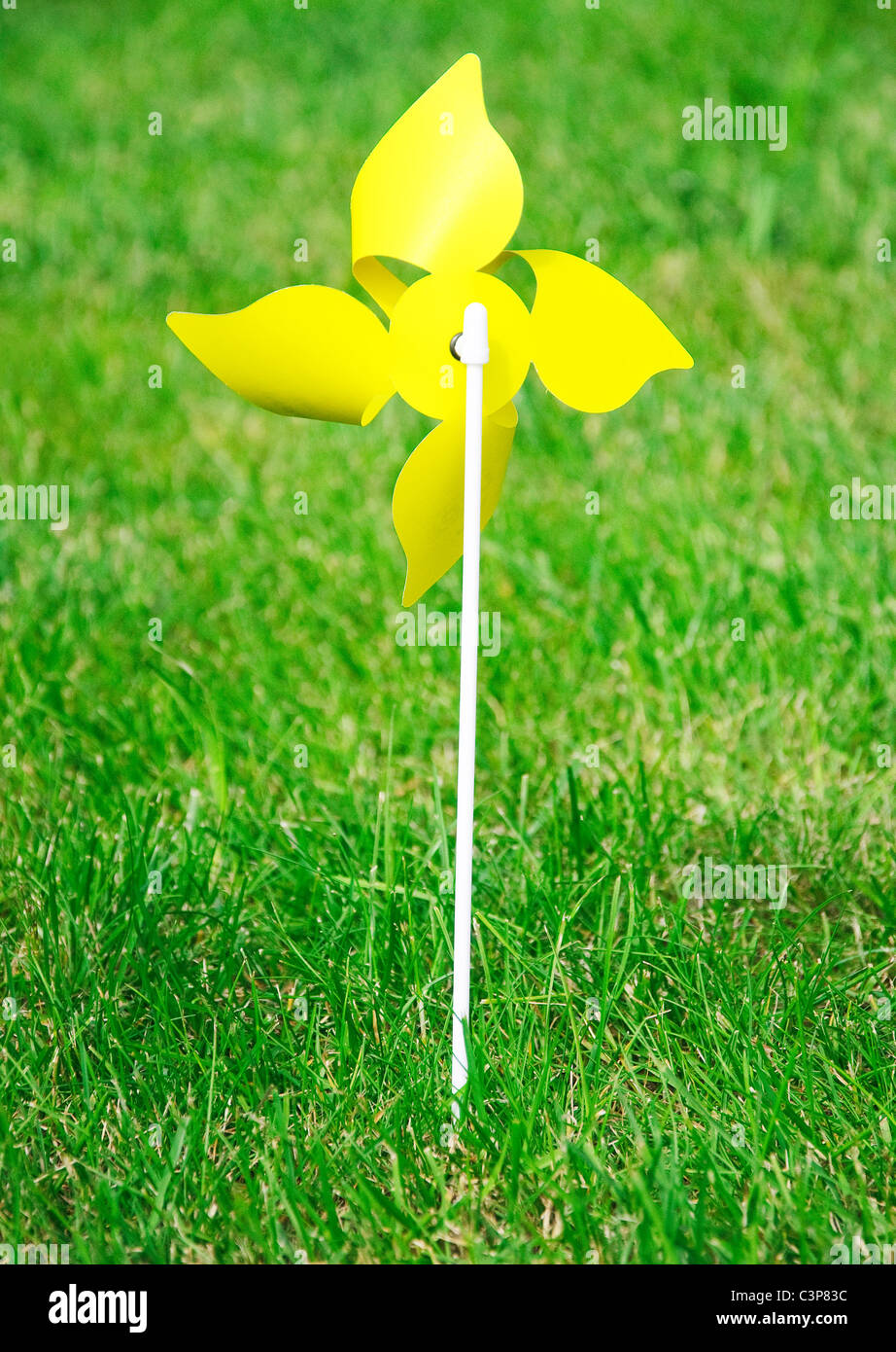 Picture showing a yellow fan in the grass Stock Photo - Alamy