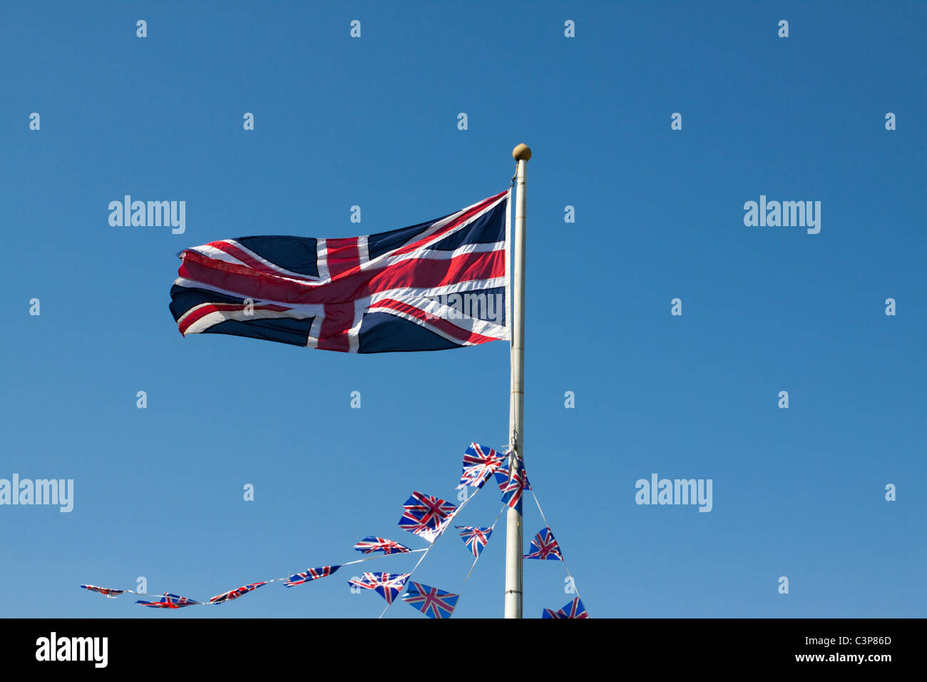 Union Jack flying from a flag pole Stock Photo - Alamy