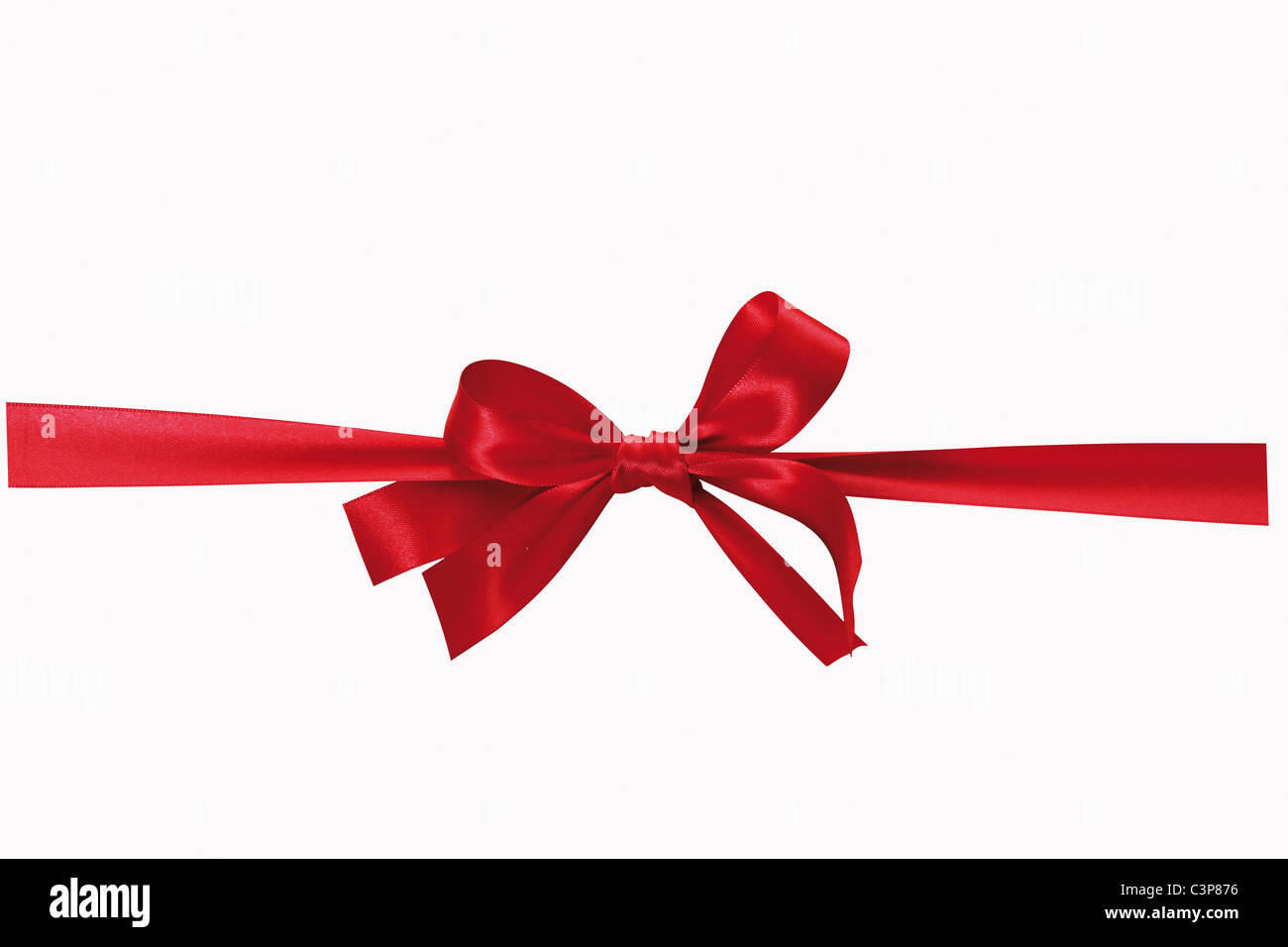 Red bow against white background, close-up Stock Photo - Alamy