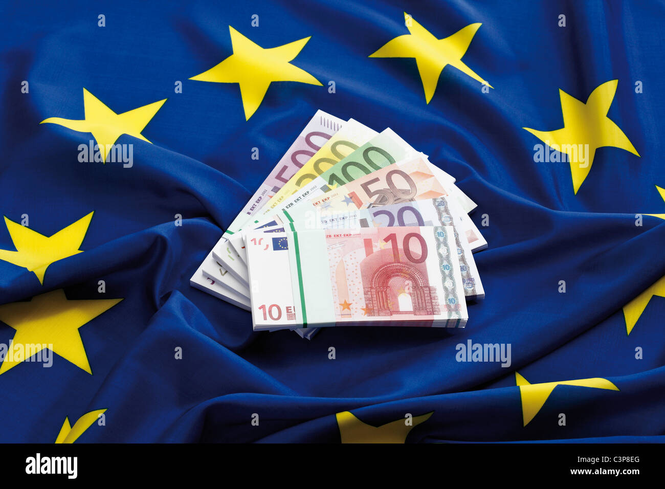Euro notes fanned out on european union flag Stock Photo - Alamy