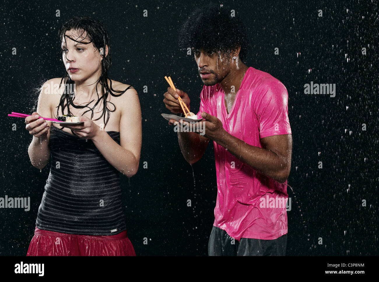 Men and women eating in rain Stock Photo - Alamy
