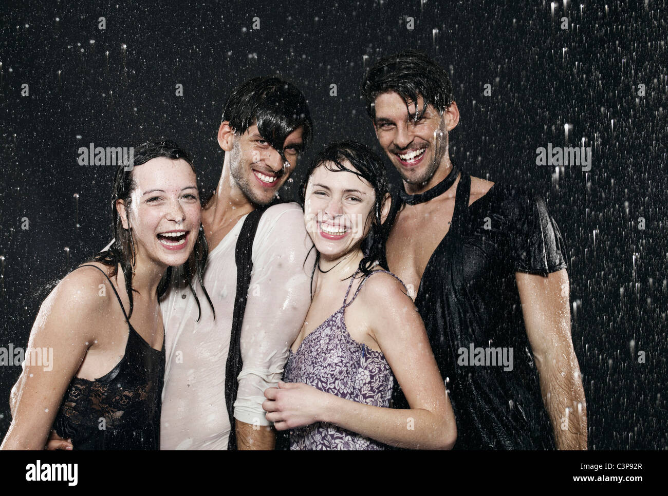 Friends enjoying in rain hi-res stock photography and images - Alamy