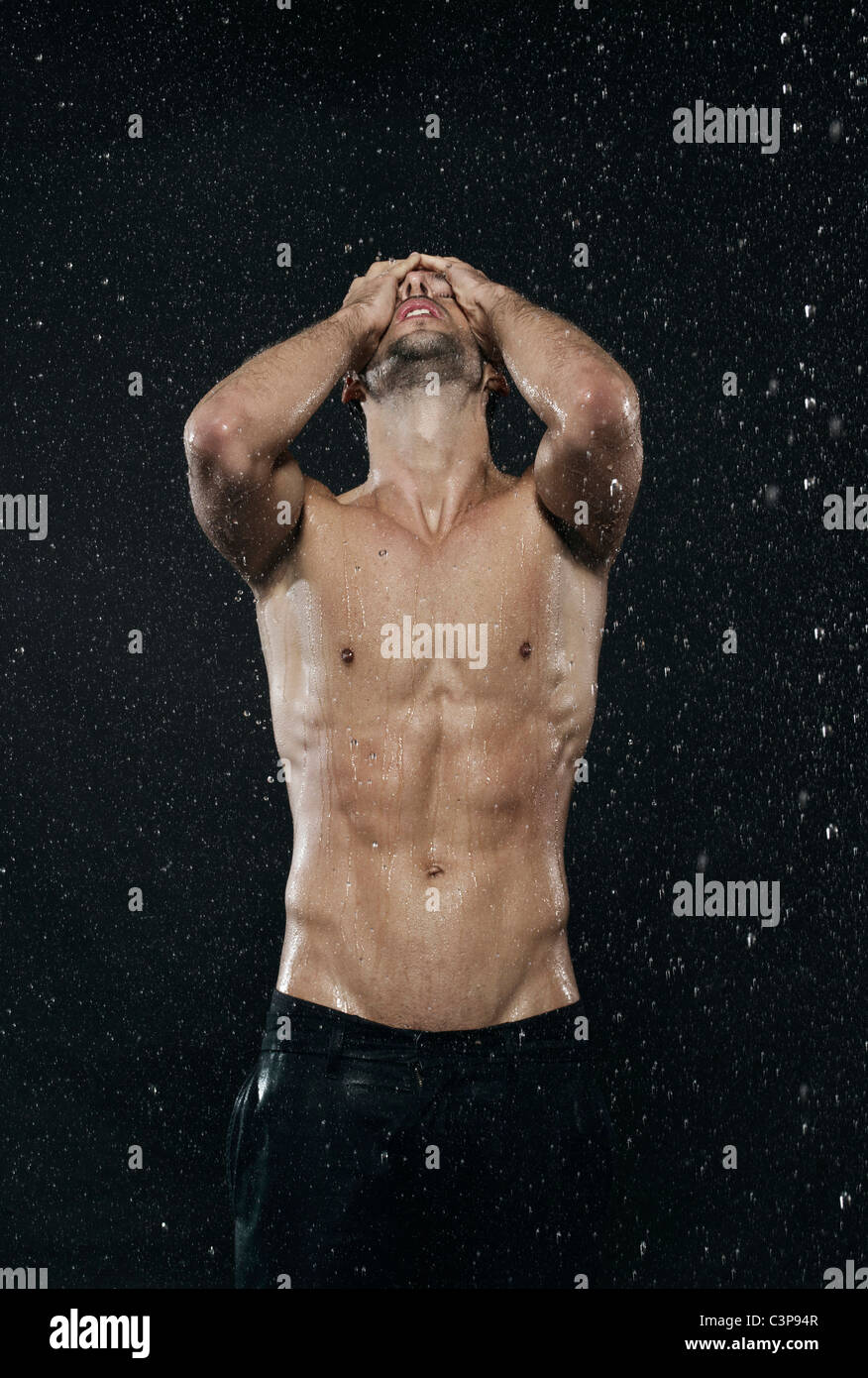 Man standing in rain, head in hand Stock Photo - Alamy