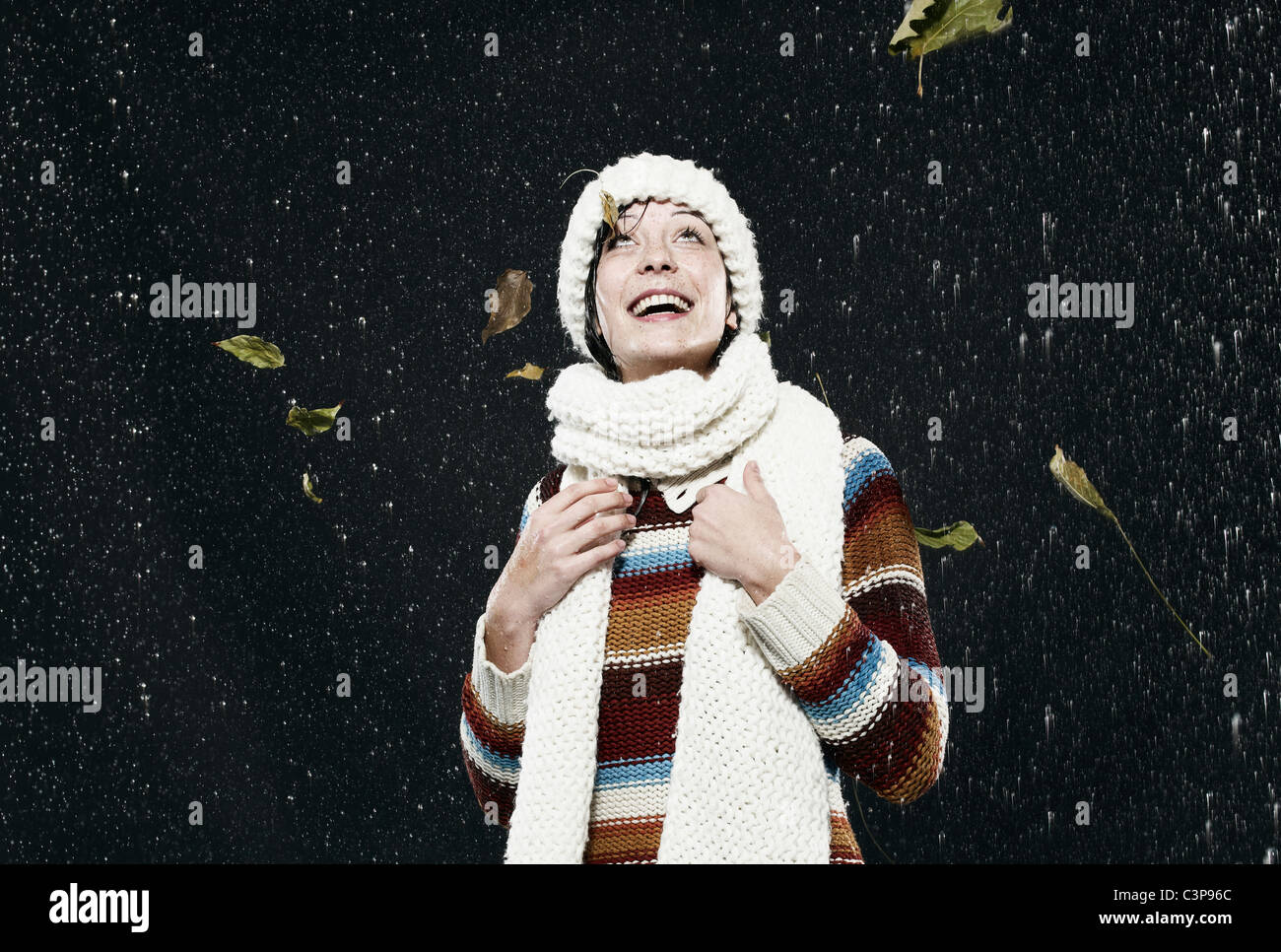 Woman enjoying in rain, smiling, looking up Stock Photo - Alamy
