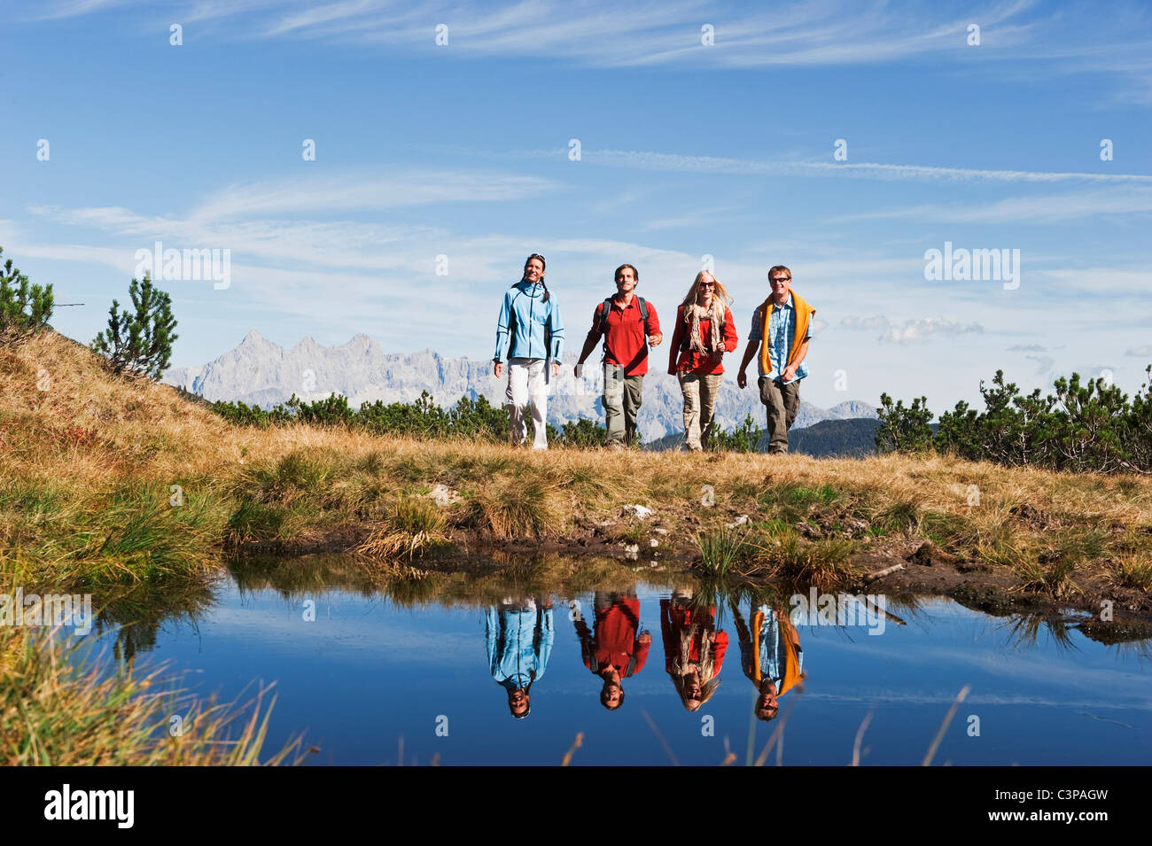 Austria, Salzburger Land, Four hikers in landscape Stock Photo - Alamy