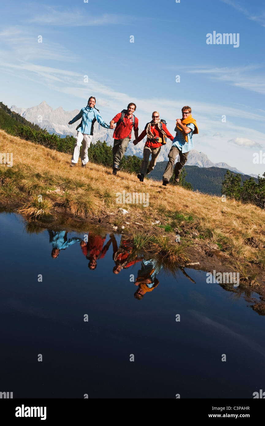Young man running across field hi-res stock photography and images - Alamy